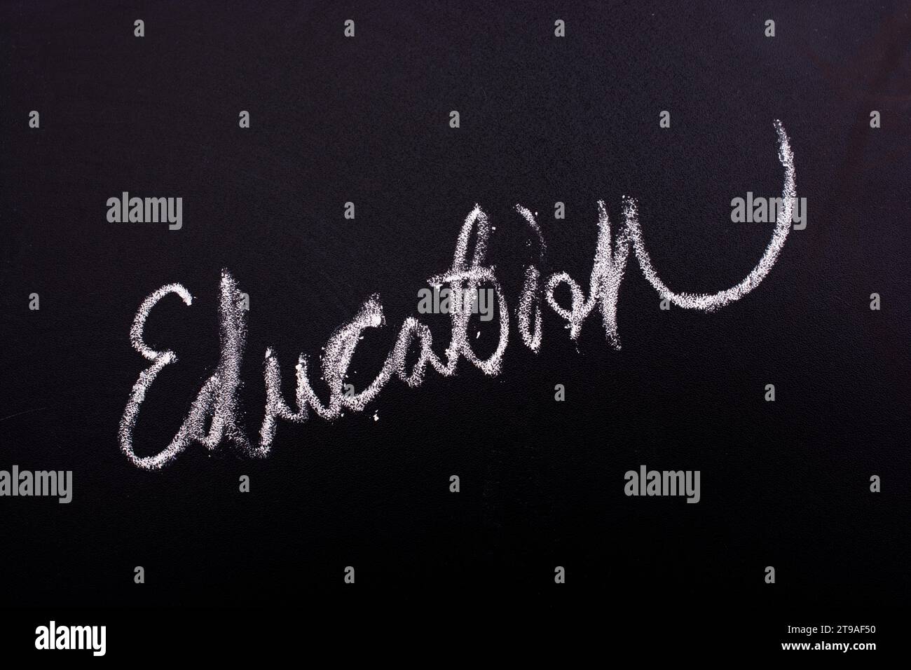Hand written word EDUCATION with white chalk on black board Stock Photo ...