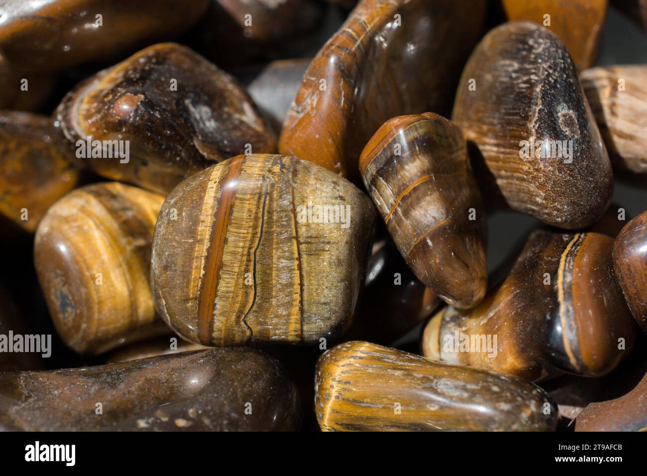 Tiger's eye and hawk's eye gemstone as natural mineral rock specimen ...