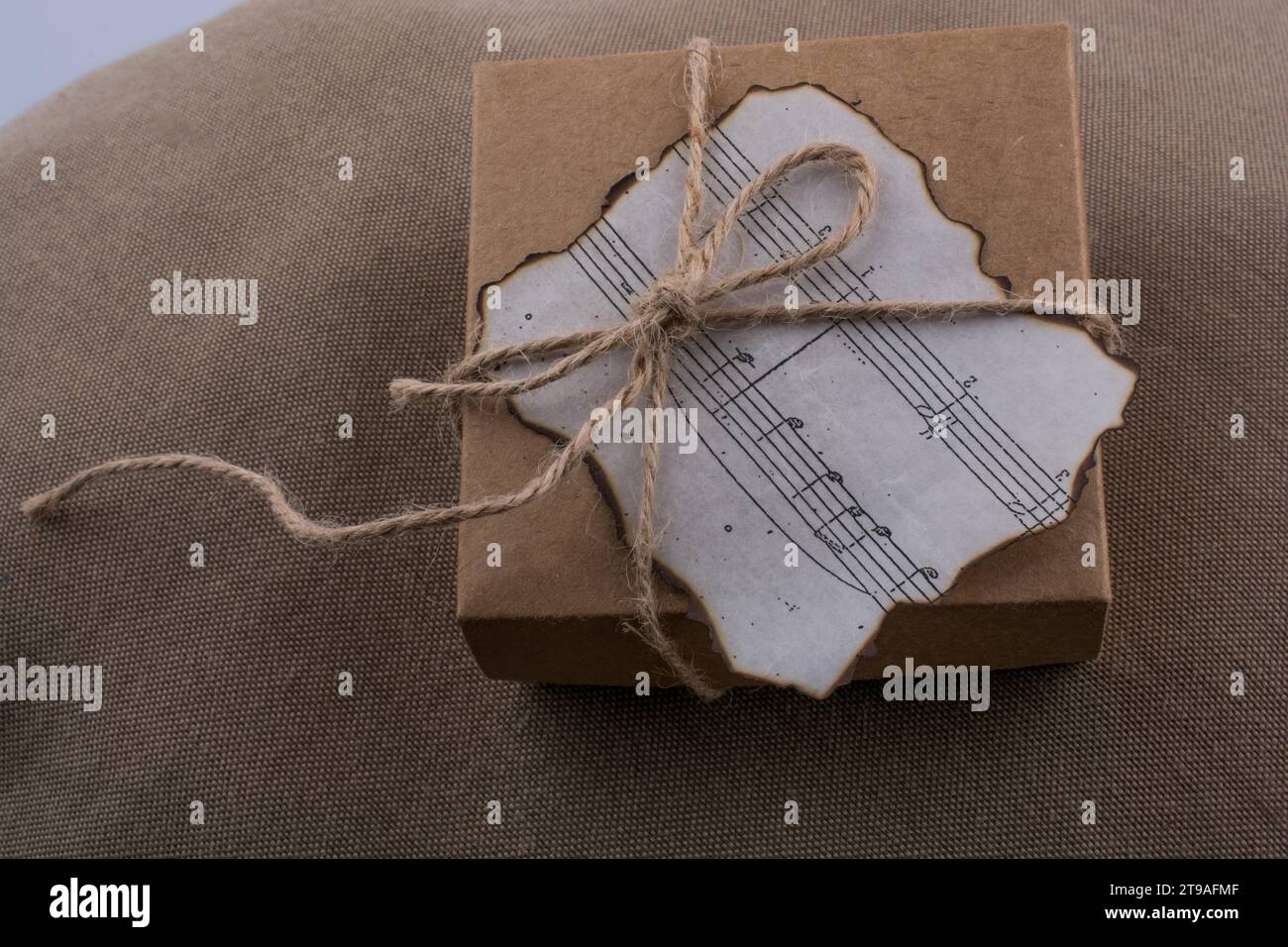Musical notes on a burnt paper on a brown background Stock Photo - Alamy