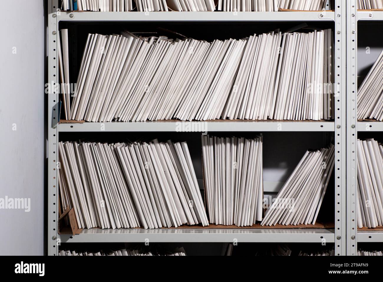 shelves with paper documents. Organized office space with neatly ...