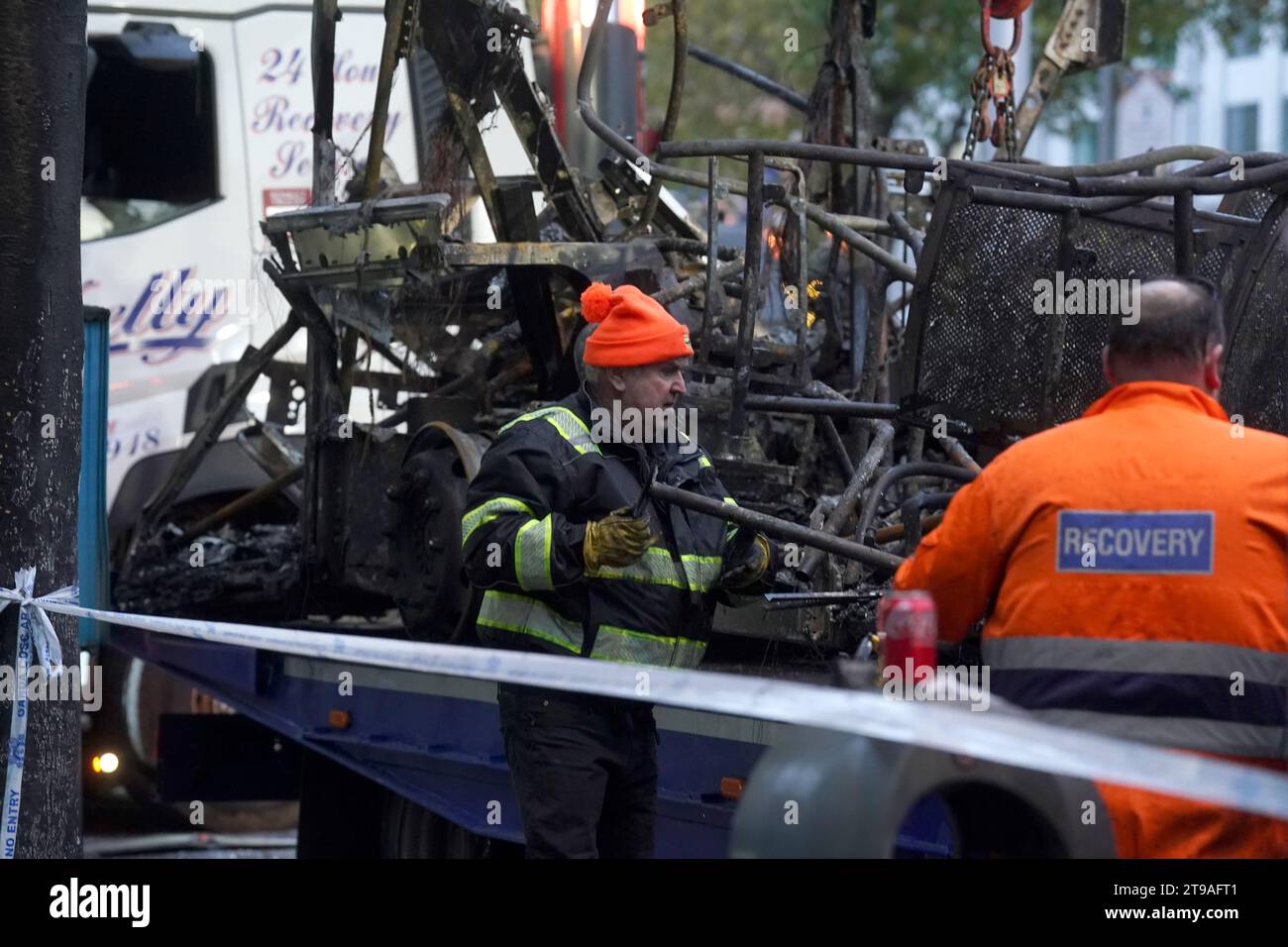 A burned out Luas is removed from O'Connell Street in Dublin, in the ...