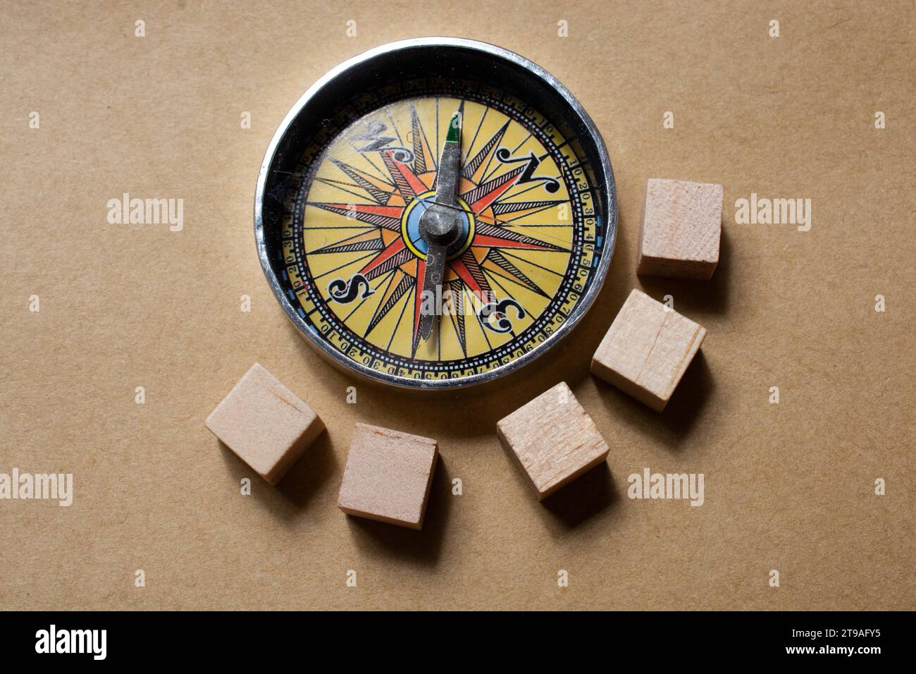 Wooden cubes Magnetic compass tool as a concept of traveling Stock ...