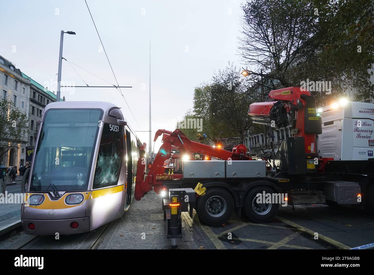 A damaged Luas with broken windows is removed from the tracks in Dublin ...