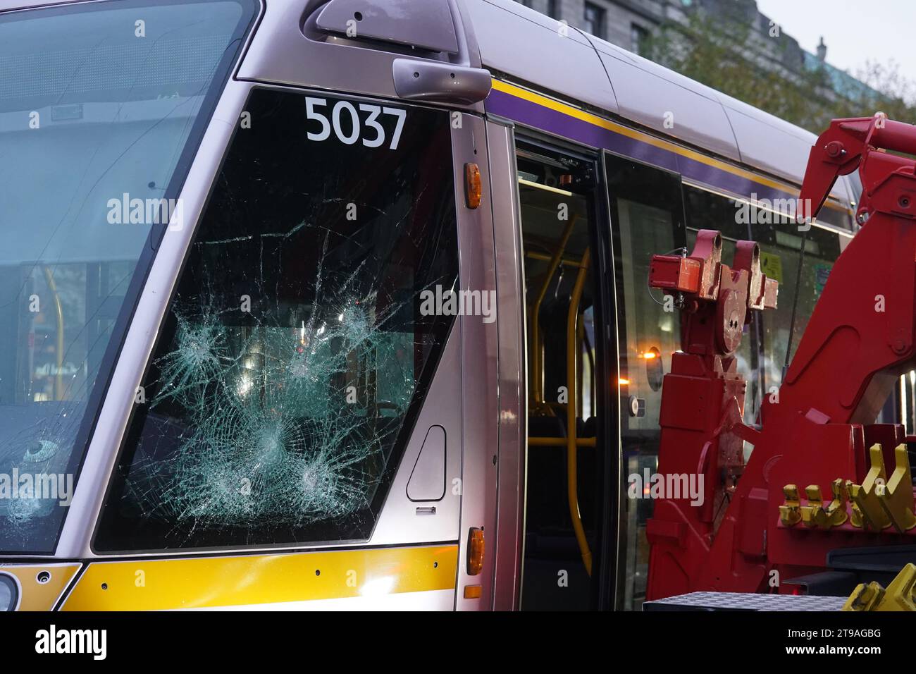A damaged Luas with broken windows is removed from the tracks in Dublin ...