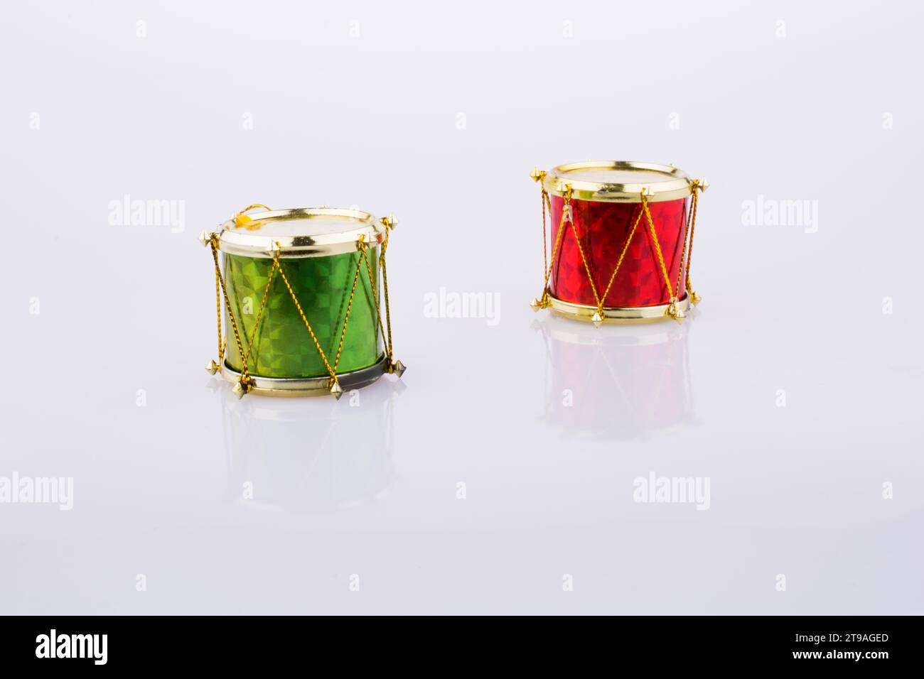 Two drums side by side on a white background Stock Photo - Alamy