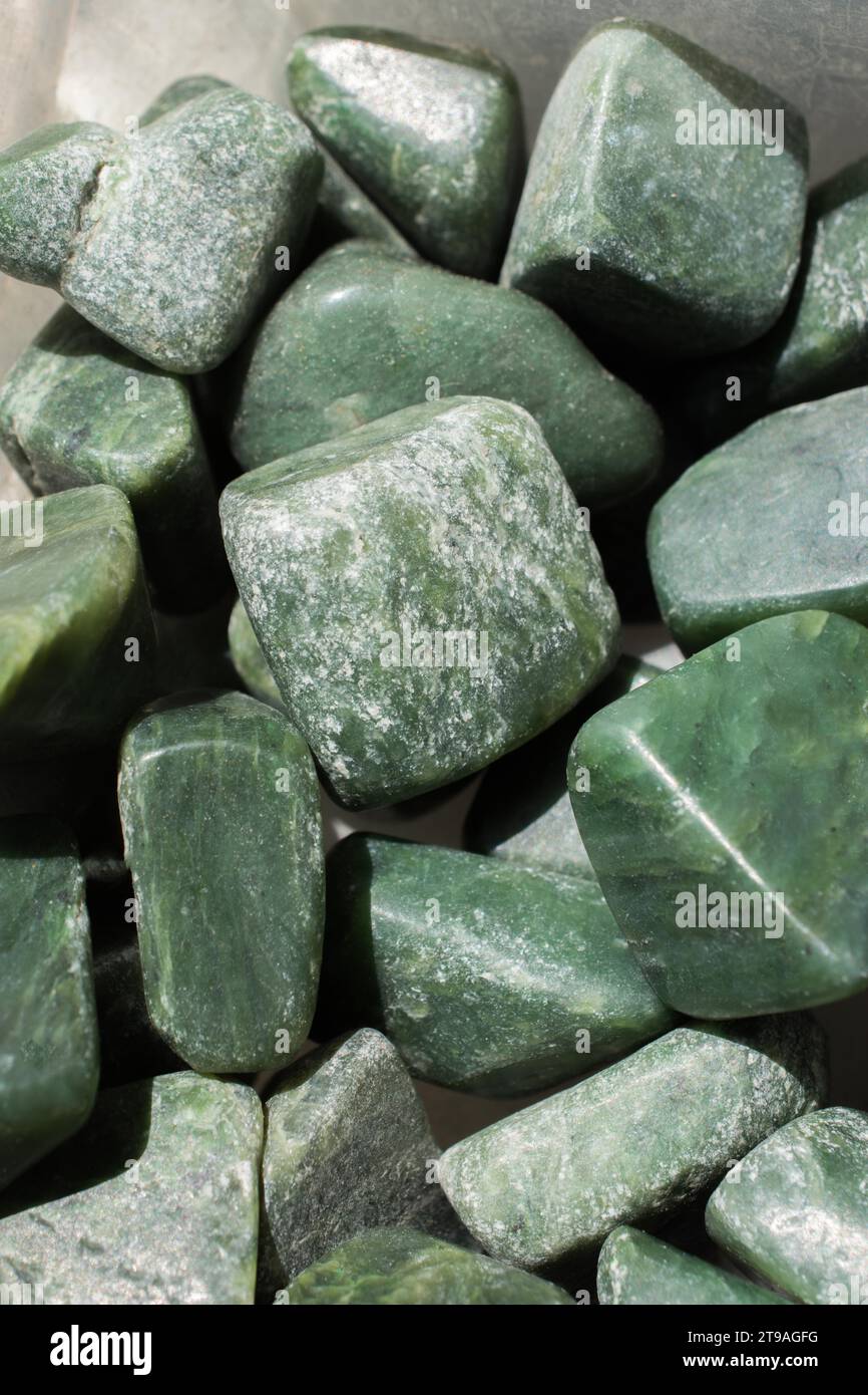 Jade gem stone as natural mineral rock specimen Stock Photo - Alamy