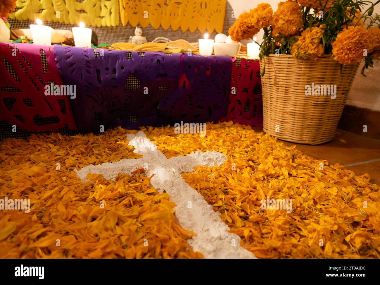 A Day of the Dead altar with lime cross cempasuchil flowers, papel ...