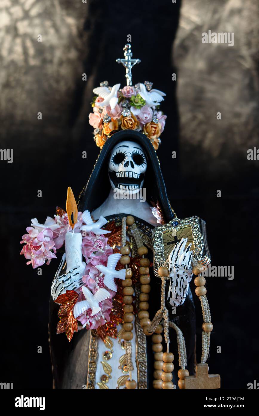 A calavera or catrina dressed as the holy death on day of the dead in ...