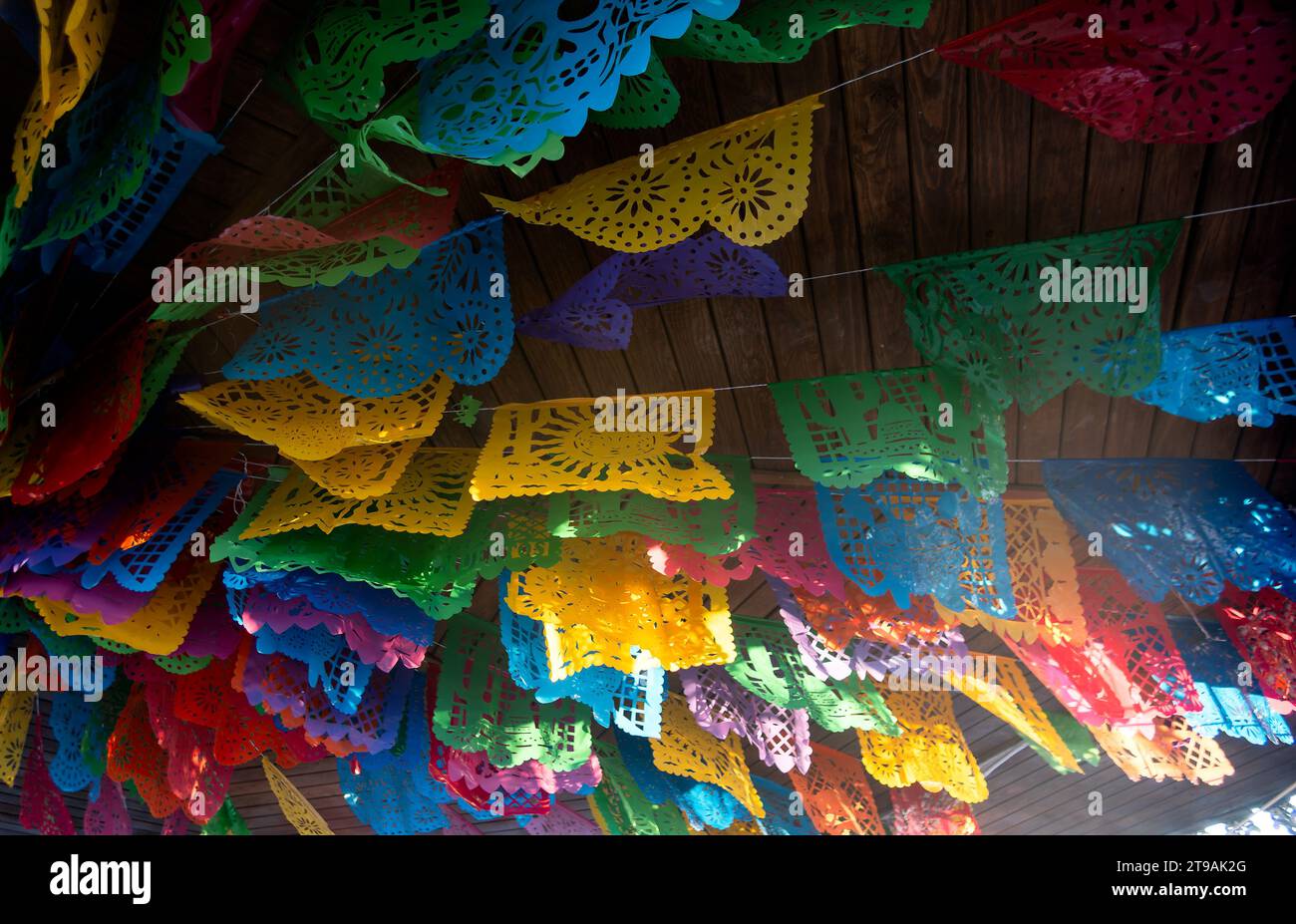 A Colorful day of the dead decorations with papel picado and mexican ...