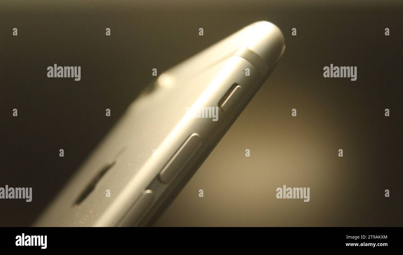 Close up look of side profile of smartphone alumunium showing mute ...
