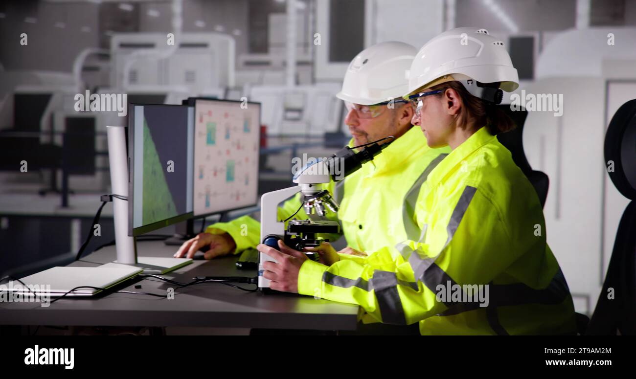 Worker in Electronic Device Factory Analyzing Data Chip at Lab Stock ...