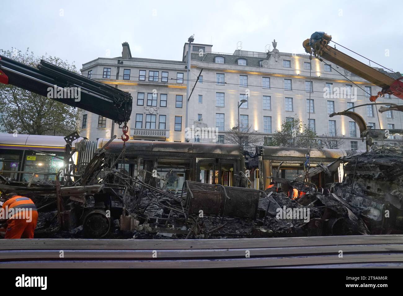 RETRANSMITTING AMENDING CAPTION TO BUS A burned out bus is removed from ...