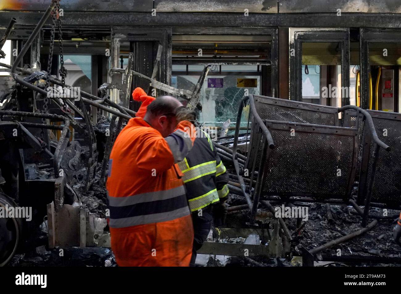 RETRANSMITTING AMENDING CAPTION TO BUS A burned out bus is removed from ...