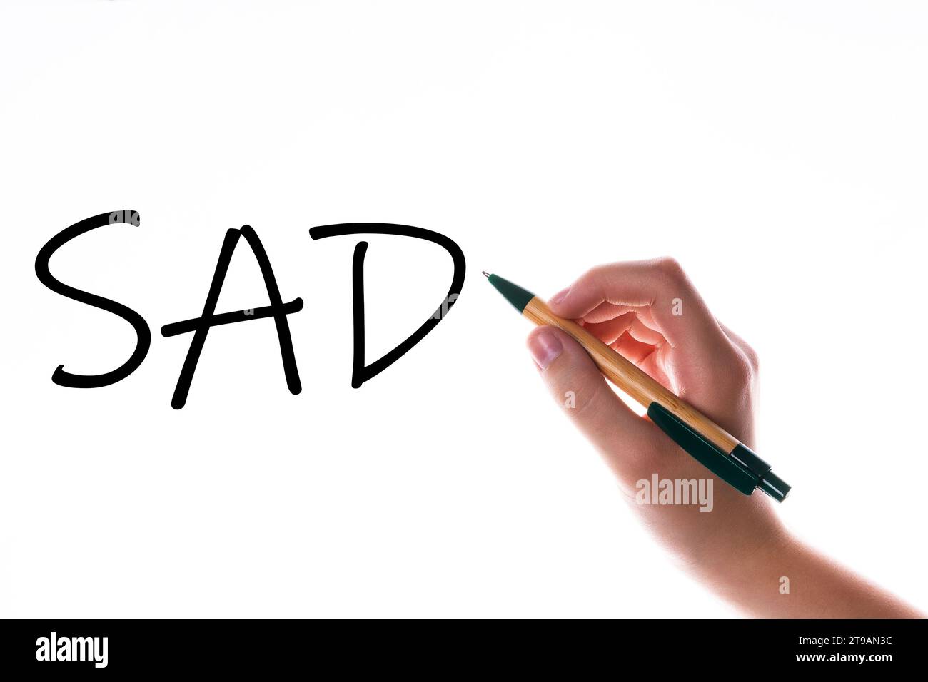 Children hand with pen write on a blue white background. Writing hand ...