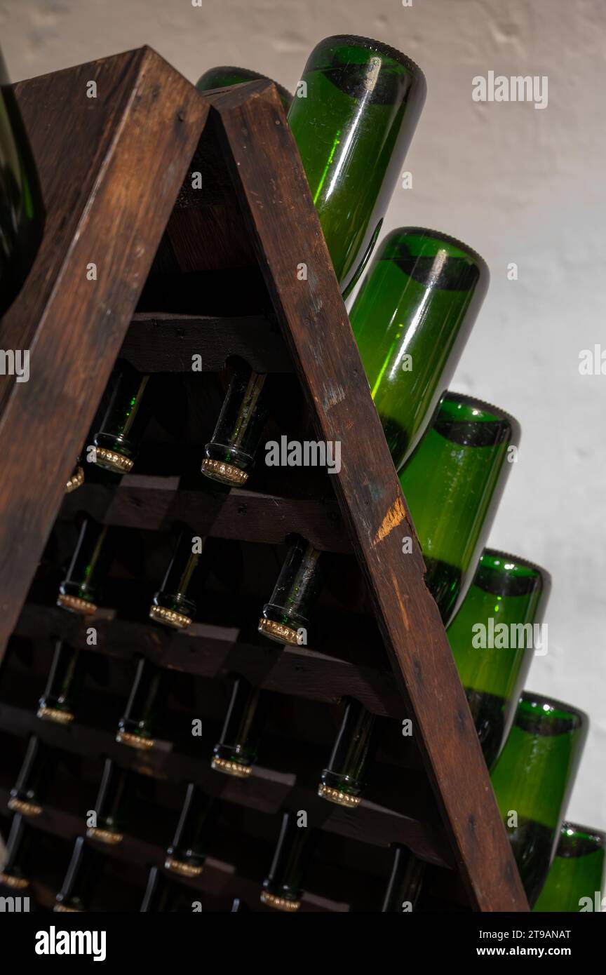 Wooden pupitre with bottles. Traditional method of production of ...
