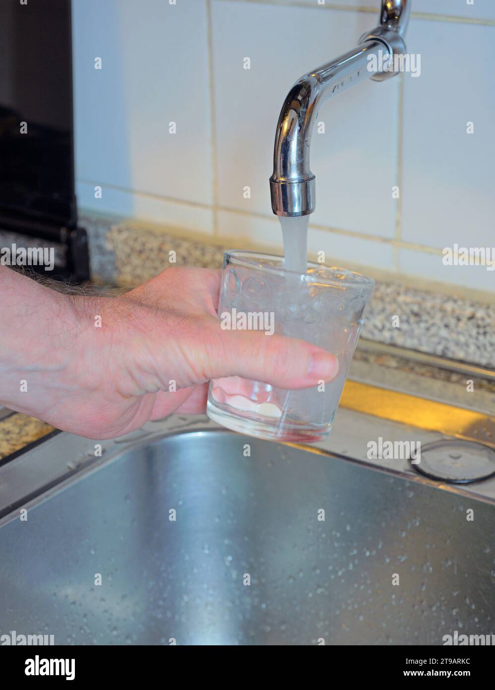 Pouring drinking water from domestic hi-res stock photography and ...