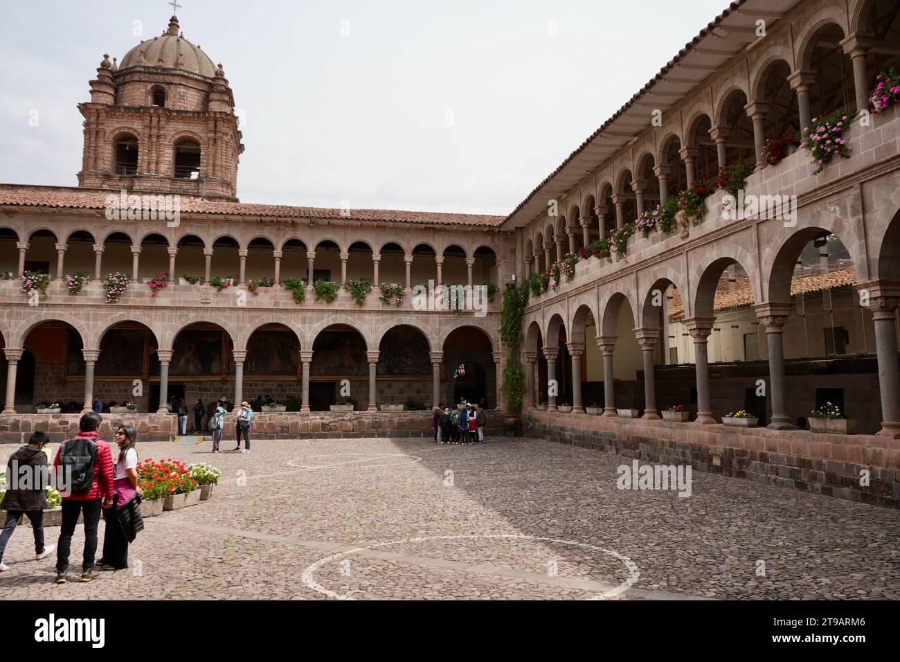 Stone arches surrounding the central courtyard of The Qorikancha or ...