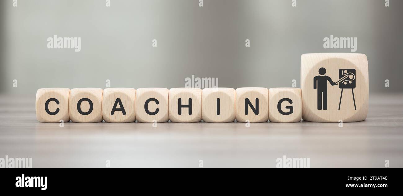 Wooden blocks with symbol of coaching concept Stock Photo - Alamy