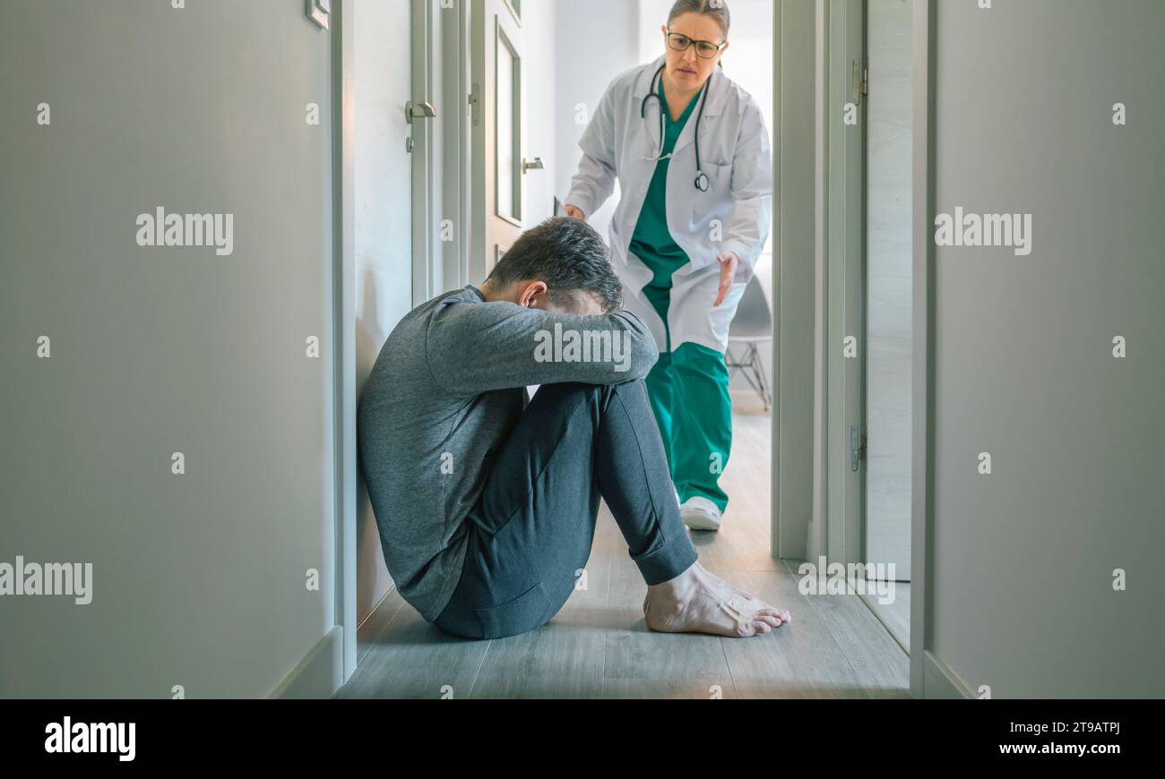 Female doctor running to help patient with mental disorder sitting on ...
