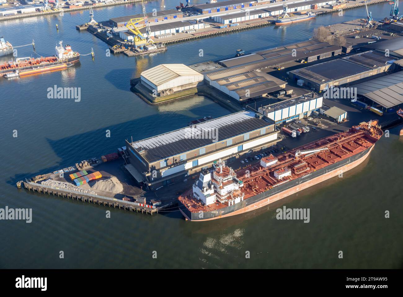 Aerial view Dutch industrial harbor Botlek near Rotterdam with harbors ...