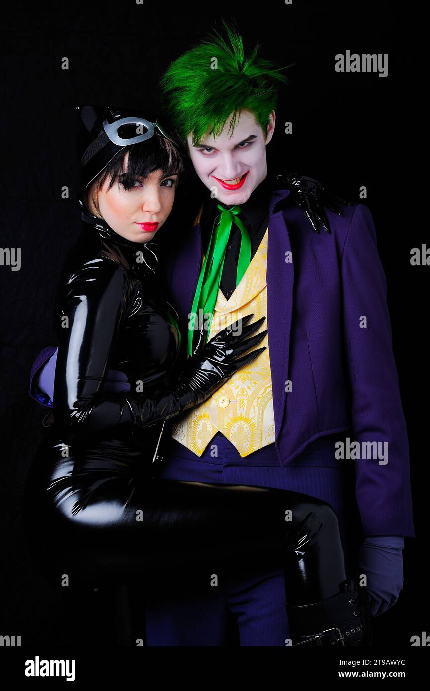Portrait of a man and woman dressed as comic book characters. at a ...