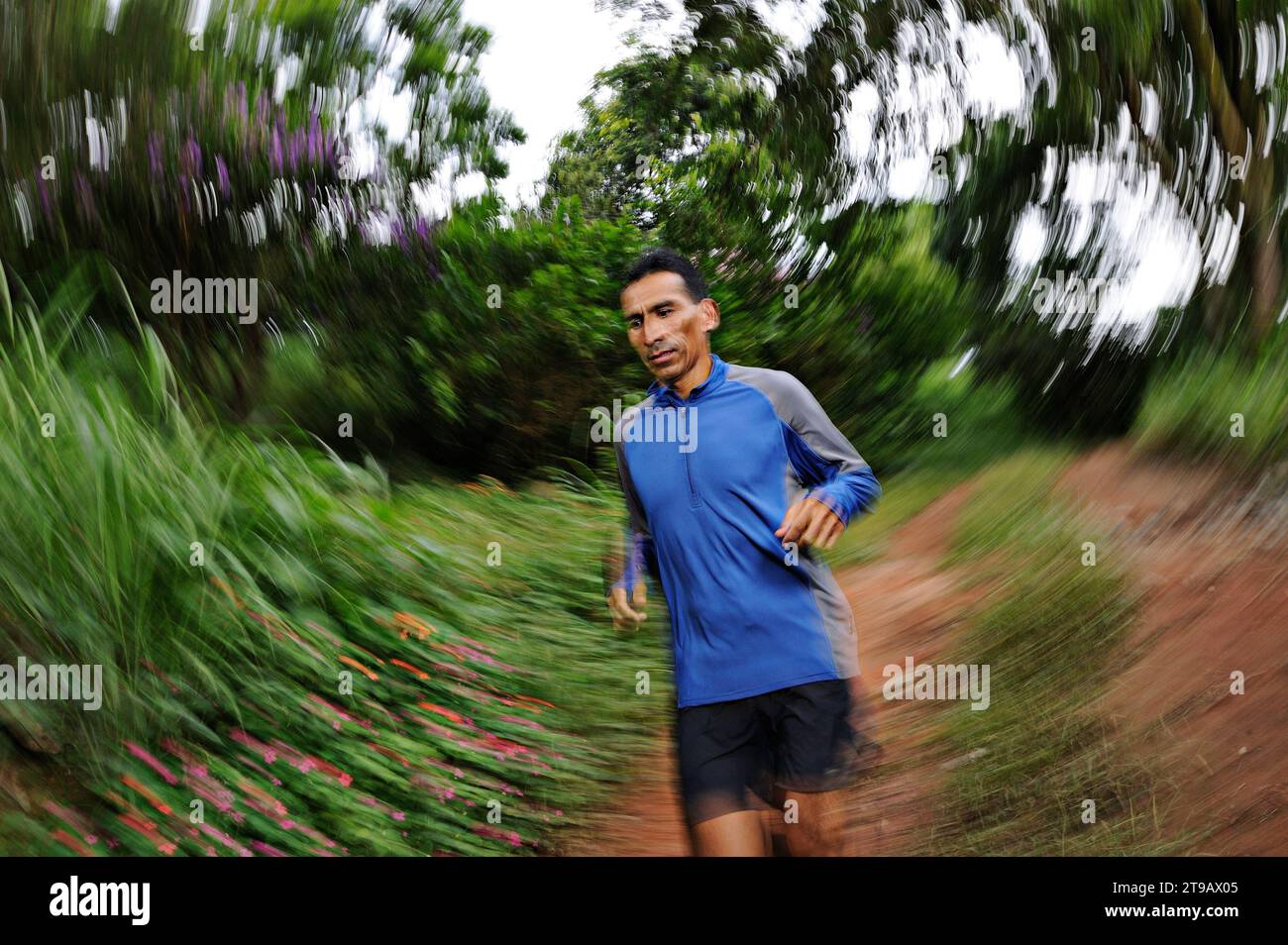 Elite ultra marathon runner runs on a trail in Brazil a few days before ...