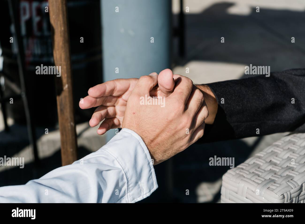 Hands of friendly men greeting each other. close up Stock Photo - Alamy