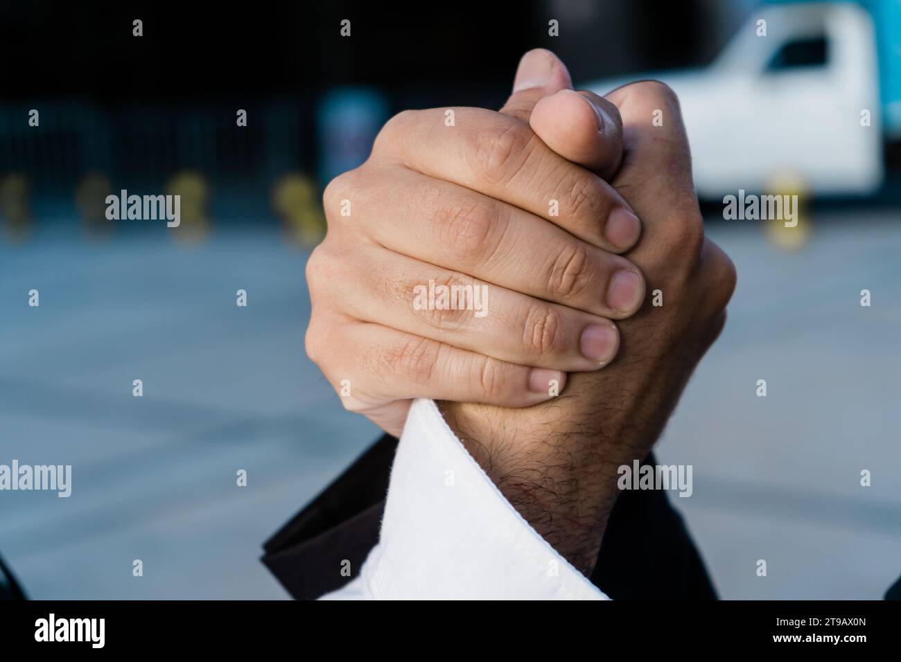 Two friends handshake hi-res stock photography and images - Alamy