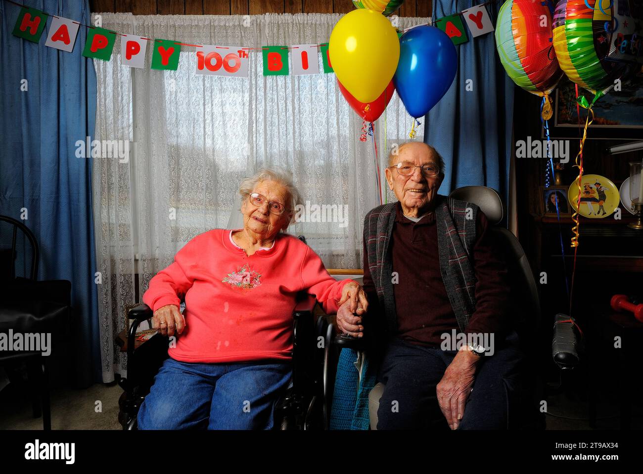 A elderly man on his 100th birthday with his wife Stock Photo - Alamy