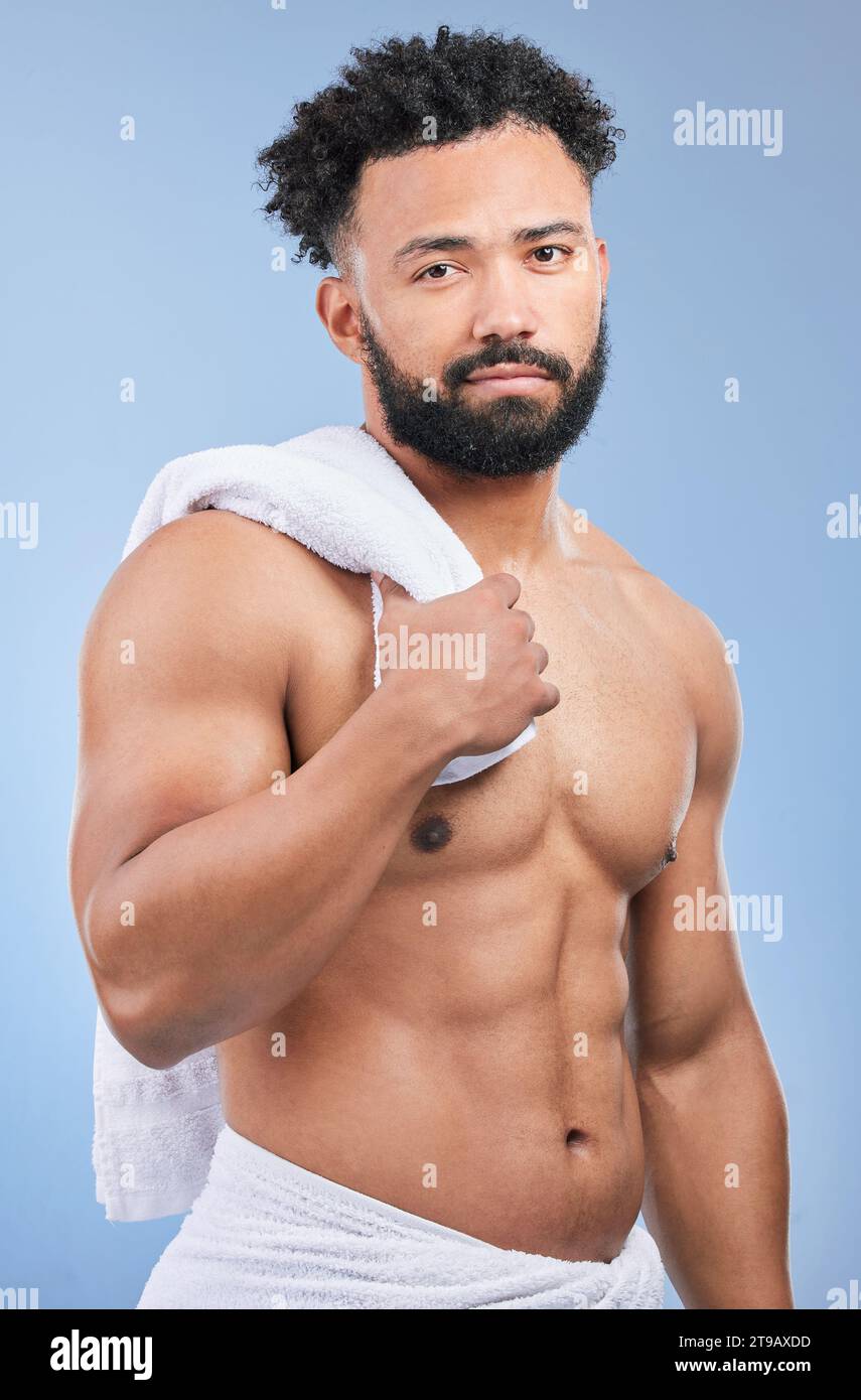 Shower towel, studio portrait and man confident in morning routine ...