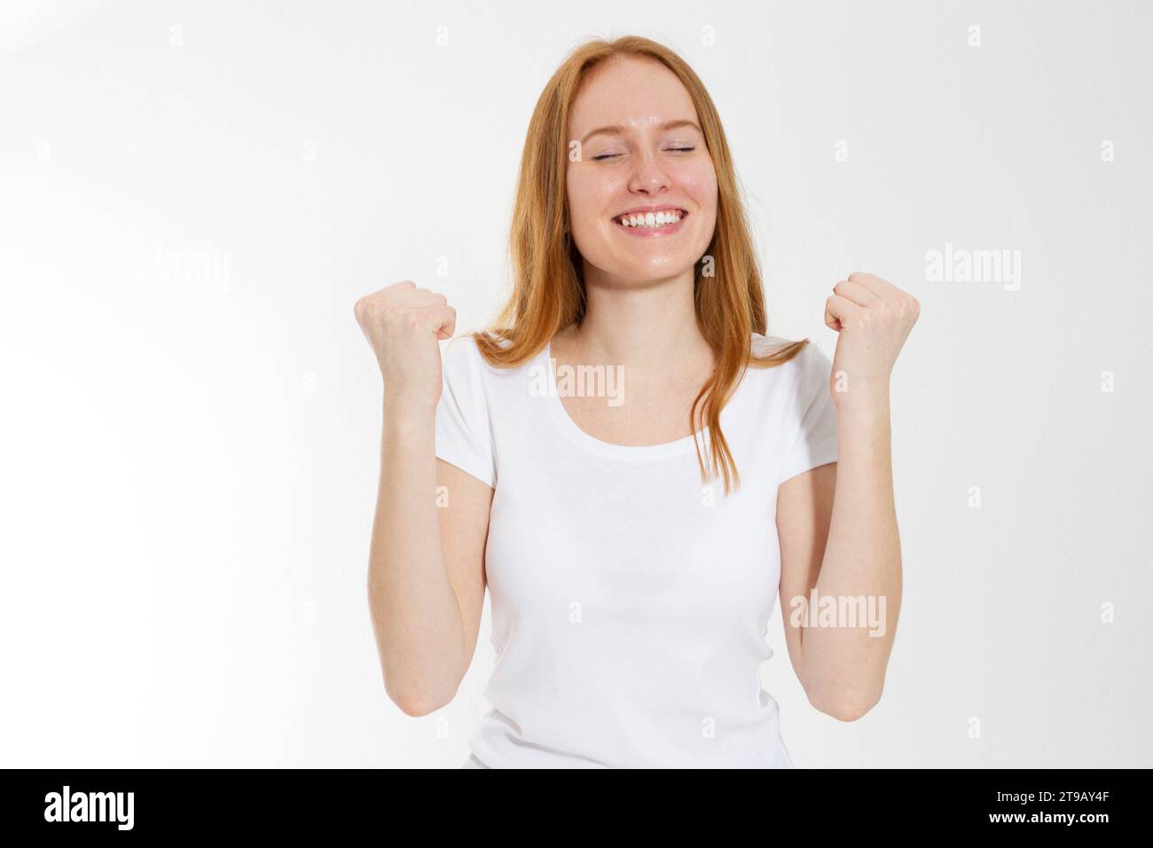 Portrait of beautiful young woman success white background Stock Photo ...