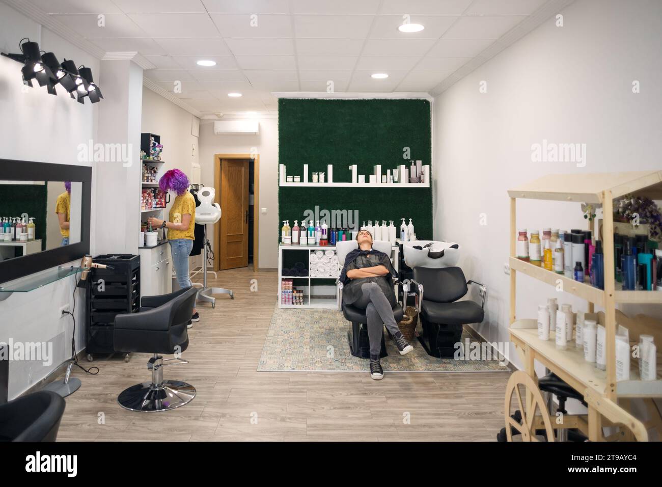 General view of hairdressing salon. Professional hairdresser with ...