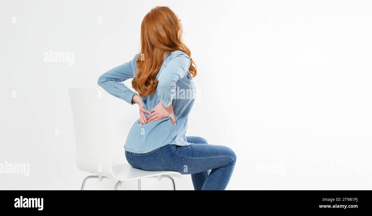 Red Hair Woman suffering from back pain. Incorrect sitting posture ...