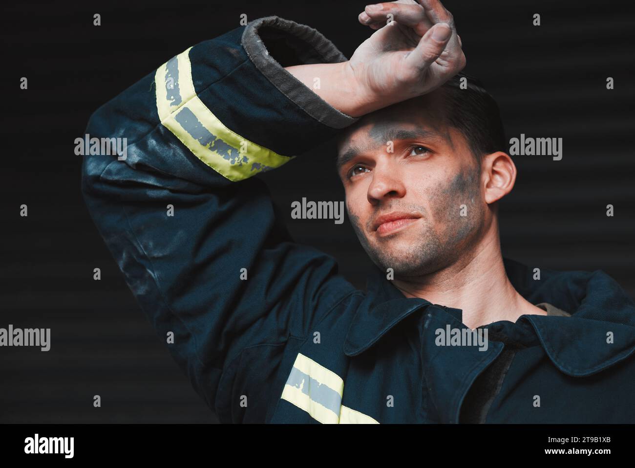 Firefighter, tired and man thinking of job on a black background with ...
