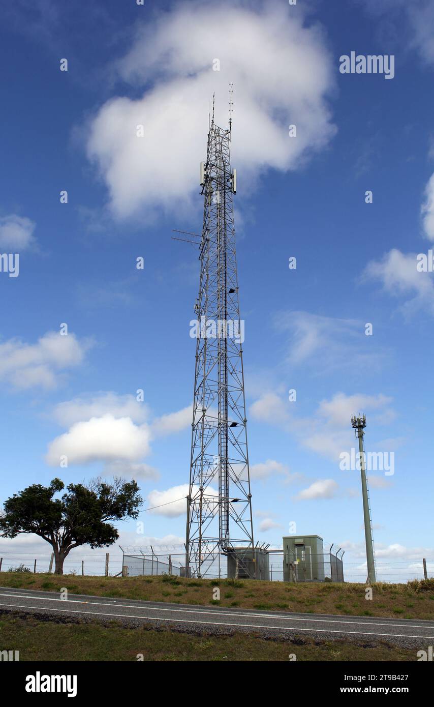 Telecommunications tower with the sky, clouds and a tree Stock Photo ...