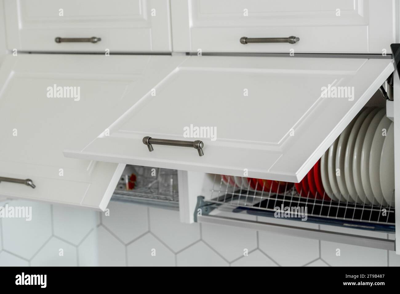 Kitchen hanging shelves with doors for storing and drying plates Stock ...