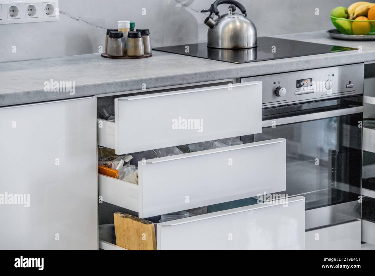 Well organized modern kitchen, three drawers are open, all kitchen ...