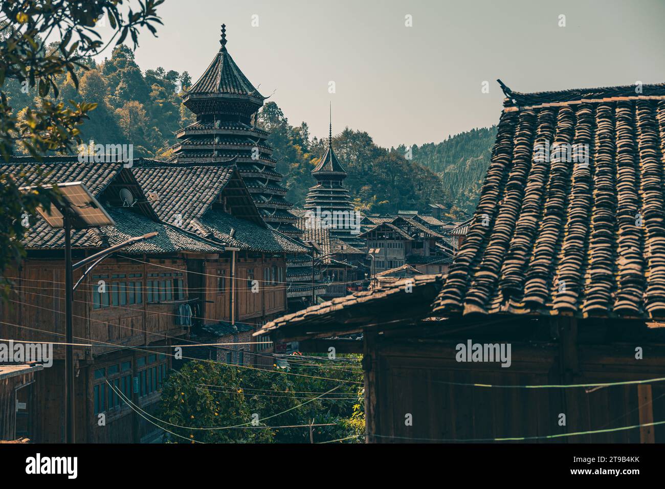 Building in Dong Village, against mountain and sky with drum tower ...