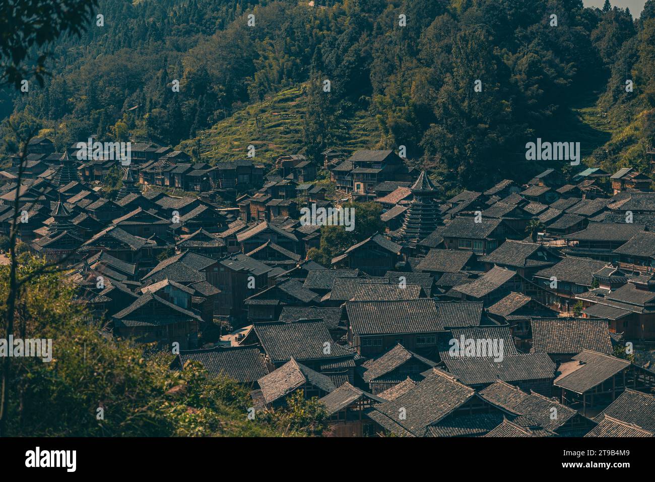 Building in Dong Village, against mountain and sky with drum tower ...