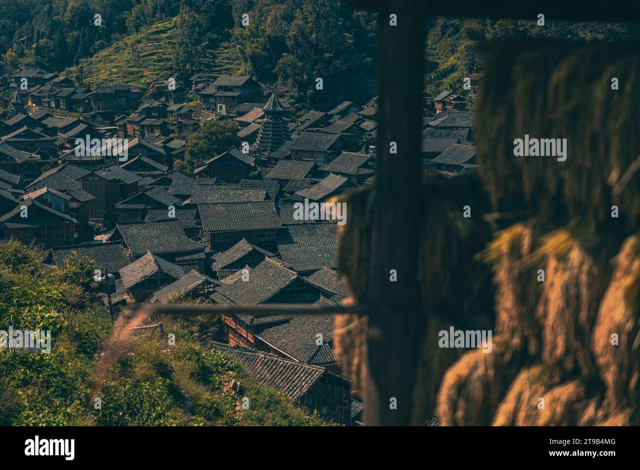 Building in Dong Village, against mountain and sky with drum tower ...