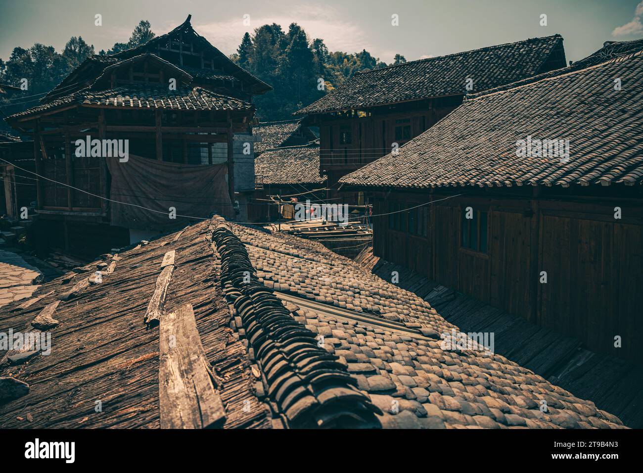 Building in Dong Village, against mountain and sky with drum tower ...