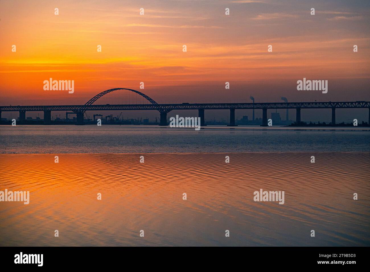 sunrise on Changjiang/ Yangtze River through a steel bridge Stock Photo ...