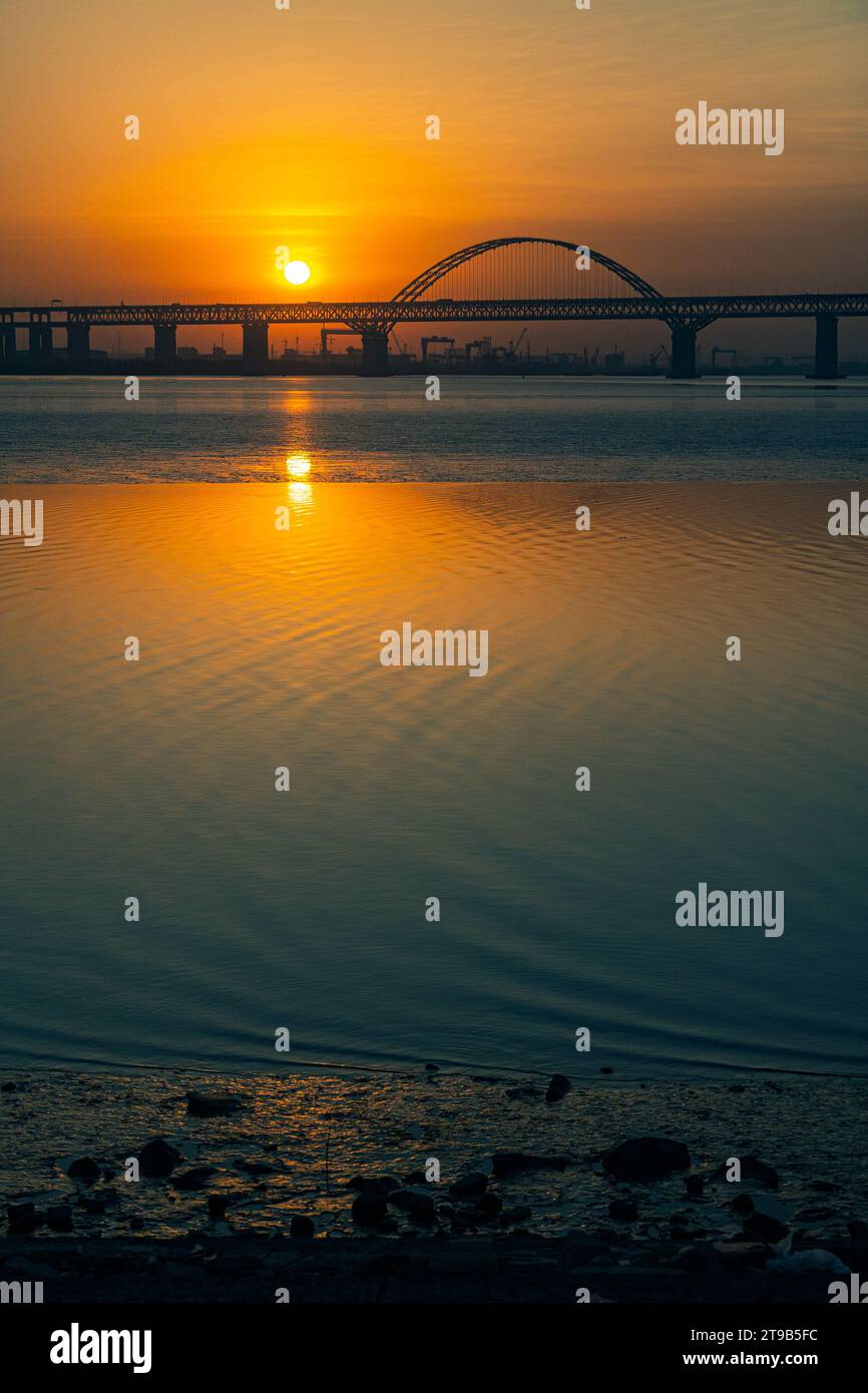 sunrise on Changjiang/ Yangtze River through a steel bridge Stock Photo ...