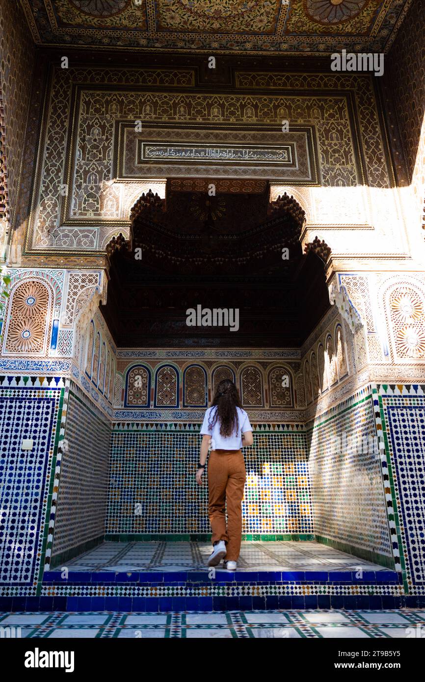 Stunning view of a girl visiting the Bahia Palace during a sunny day ...