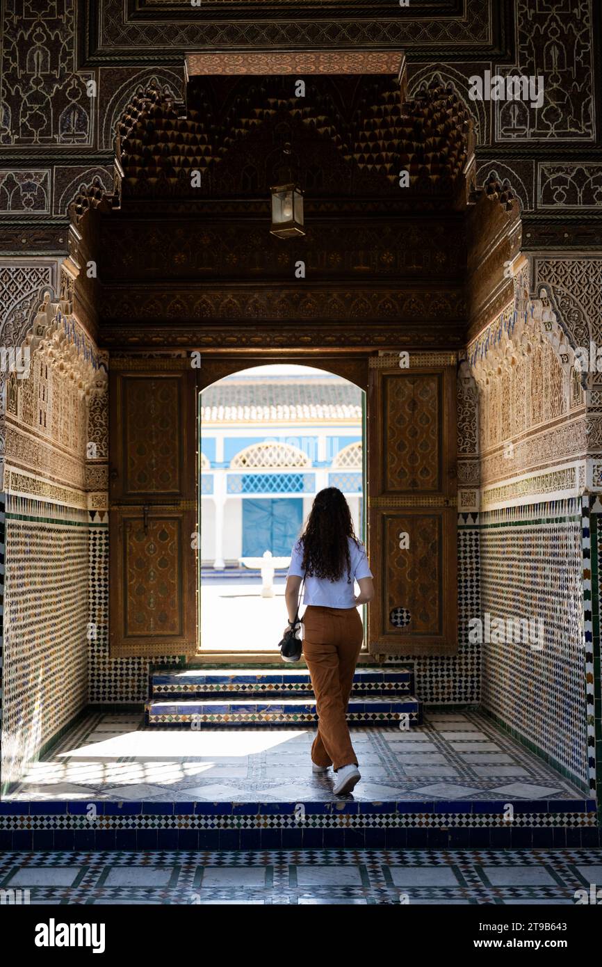 Stunning view of a girl visiting the Bahia Palace during a sunny day ...