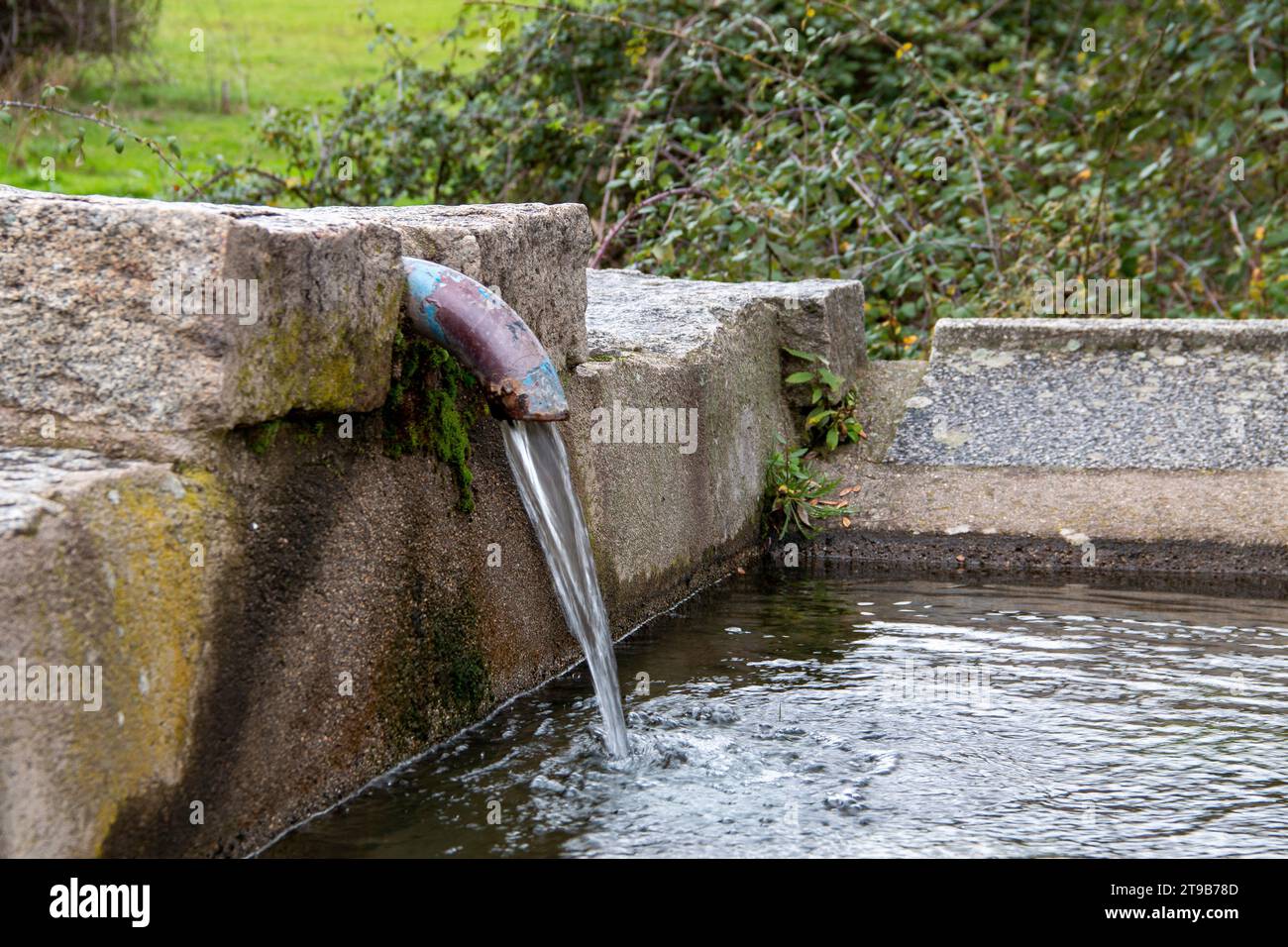 Rural fountain, also known as "caño" where you can see the stream of ...