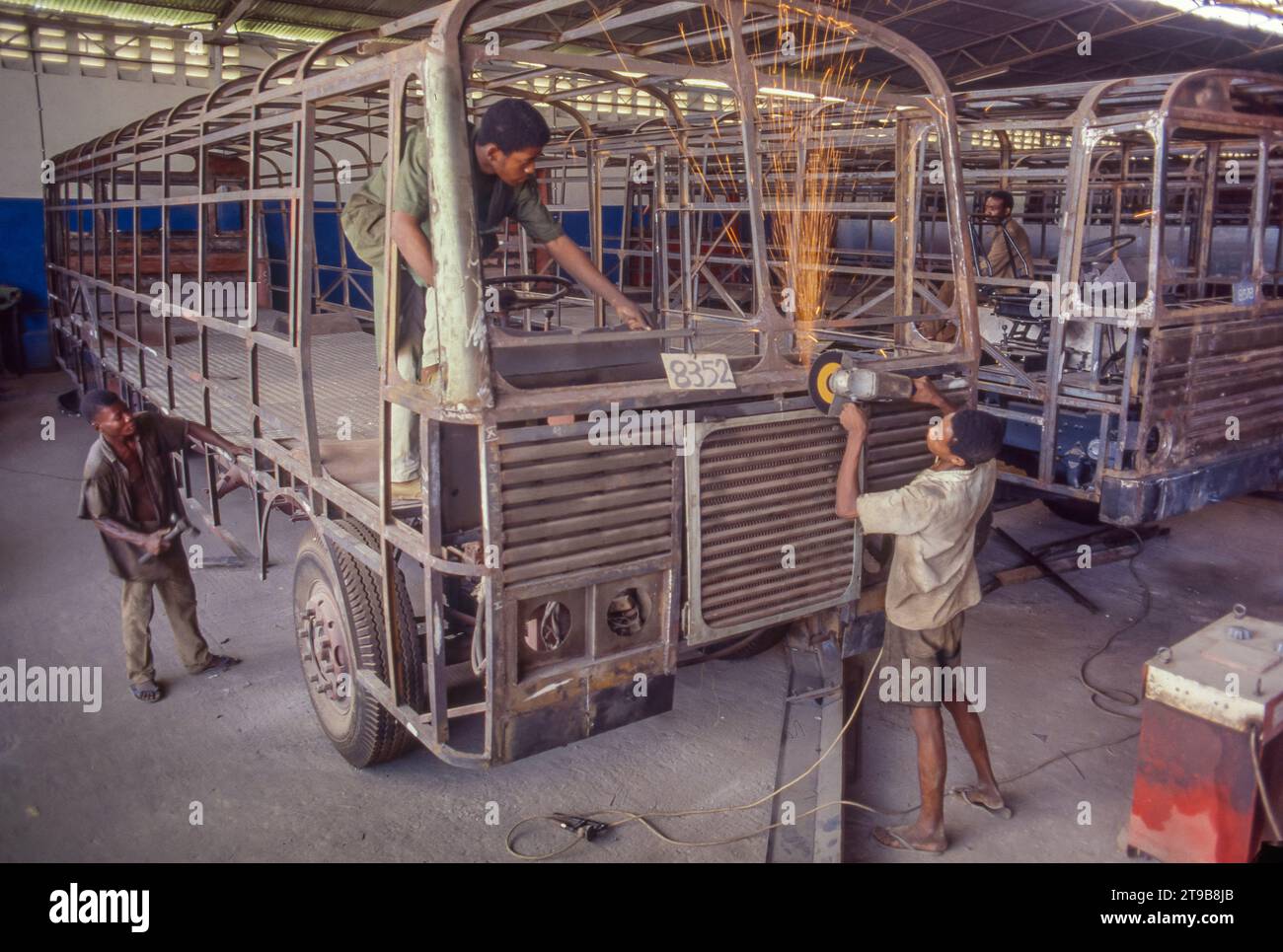 Tanzania, Dar-es-Salaam, men are working in a truck assembly factory ...