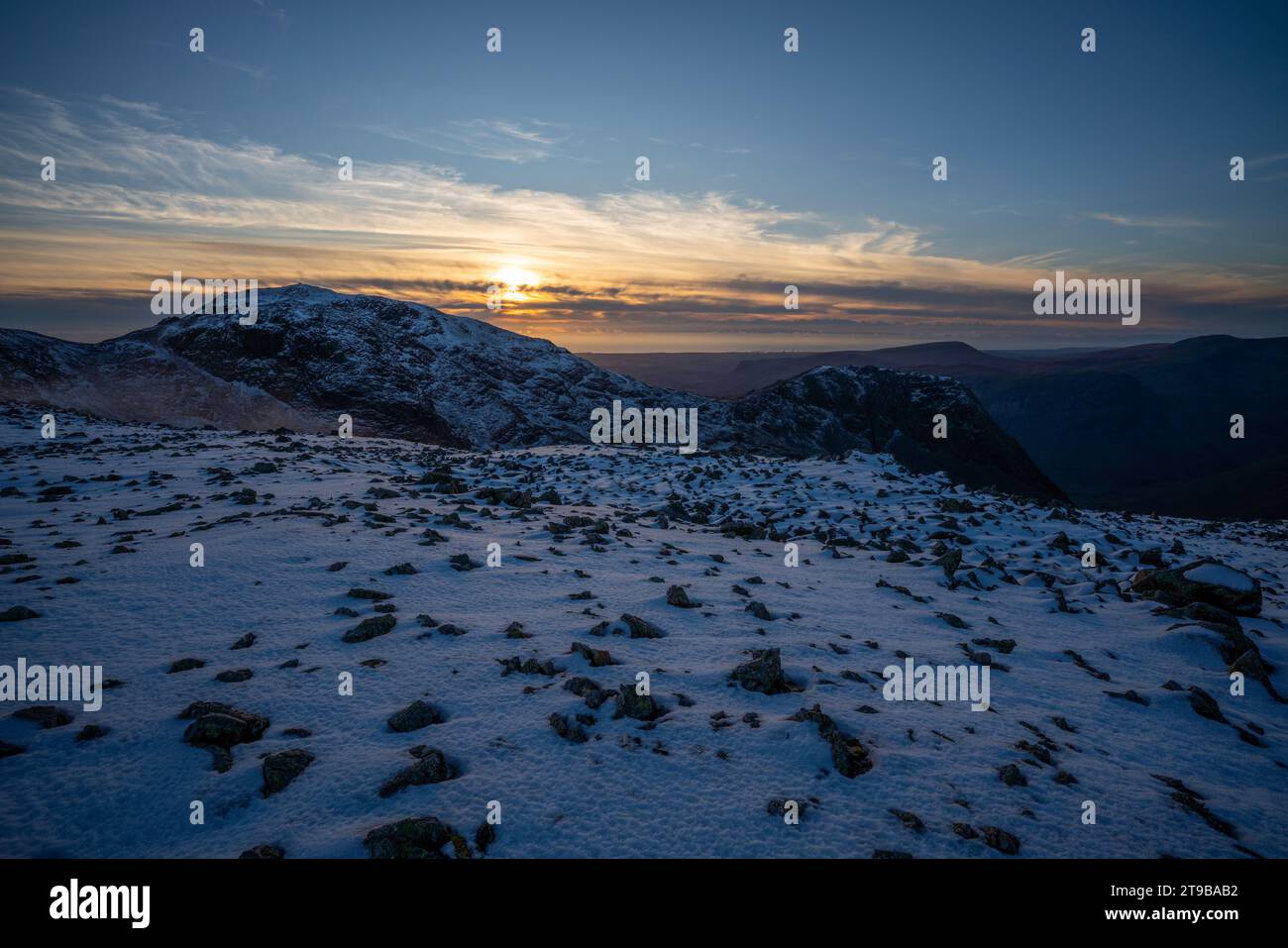 Sun set behind Scafell pike taken from Great End mountain in the lake ...