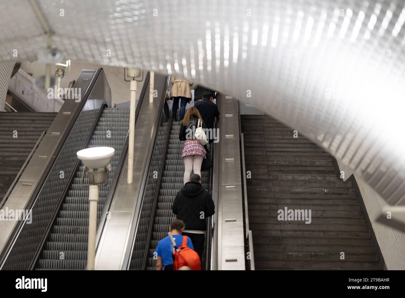 Woman riding down city stairs hi-res stock photography and images - Alamy