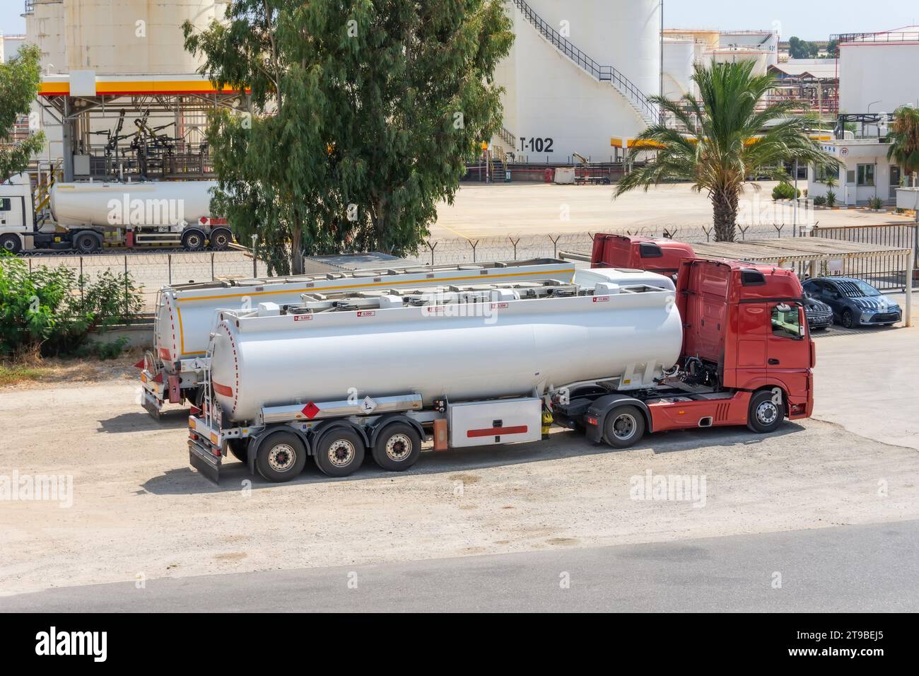 Parking row of trucks with fuel tanks of a warehouse and storage of ...